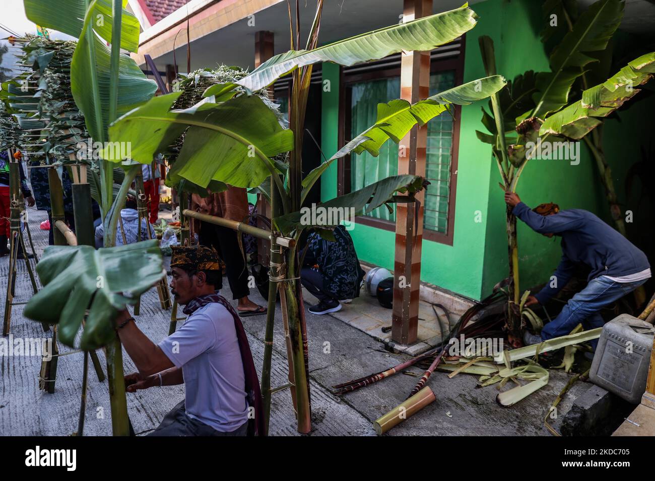 Tenggerese people making offerings of rice, fruits, vegetables, and ...