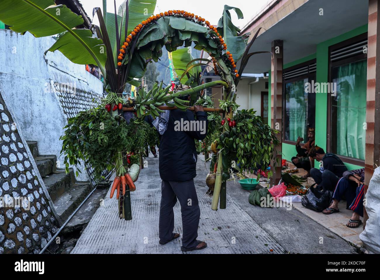 Tenggerese people making offerings of rice, fruits, vegetables, and ...