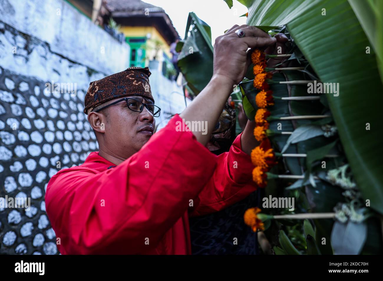 Tenggerese people making offerings of rice, fruits, vegetables, and ...