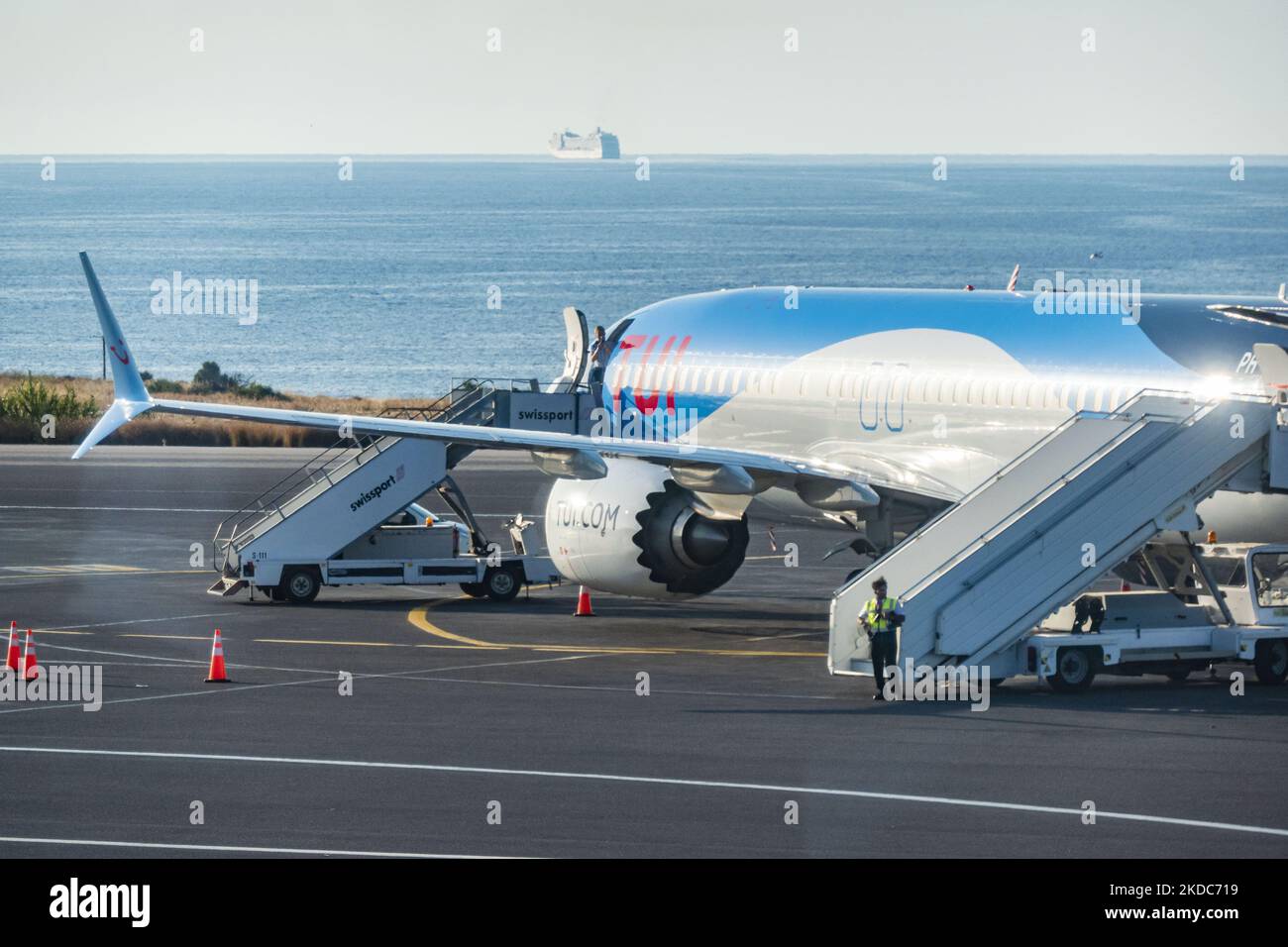 A flight attendant takes a photo from a TUI Boeing 737 after landing ...