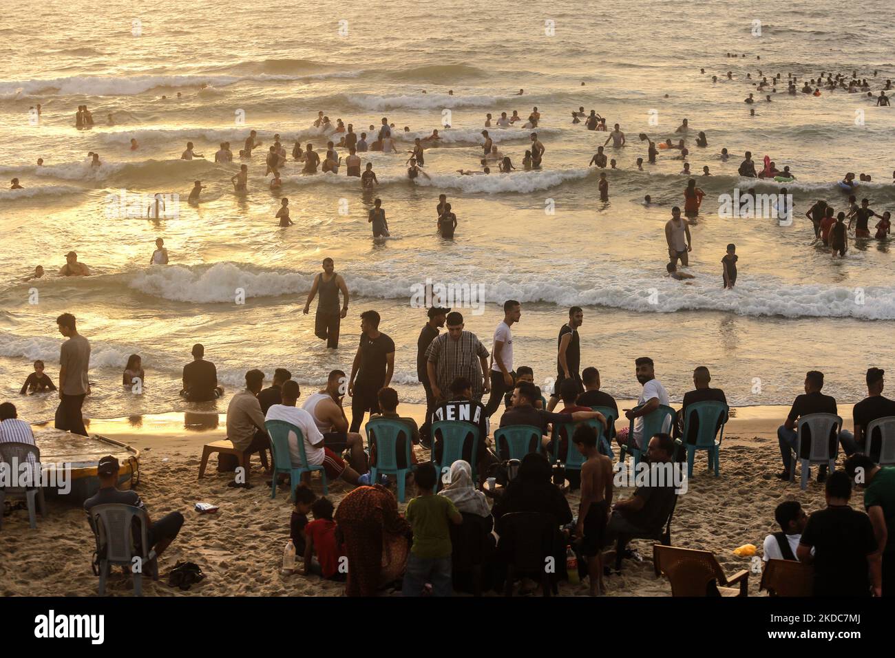 Palestinians people swim in Gaza Beach to cool off on a hot day and ...
