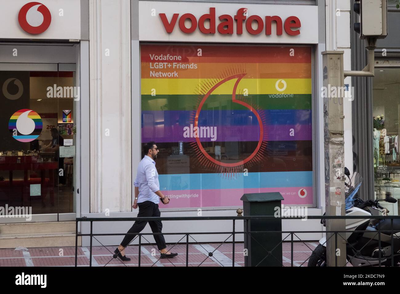 A Vodafone store with pride flag on store window in the center of ...