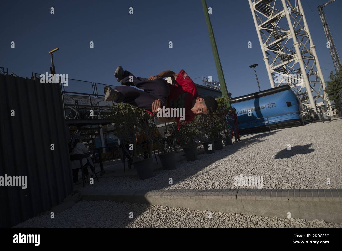 Iranian bungee man, Mahdi Gordan-21, practices while waiting to perform ...