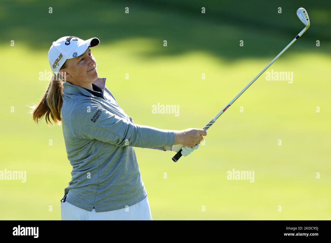 Gemma Dryburgh of Scotland follows her shot toward the first green ...