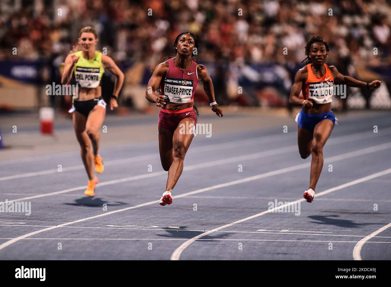 Shelly-Ann Freser-Pryce of Jamaica (C) competes in 100 meters women ...
