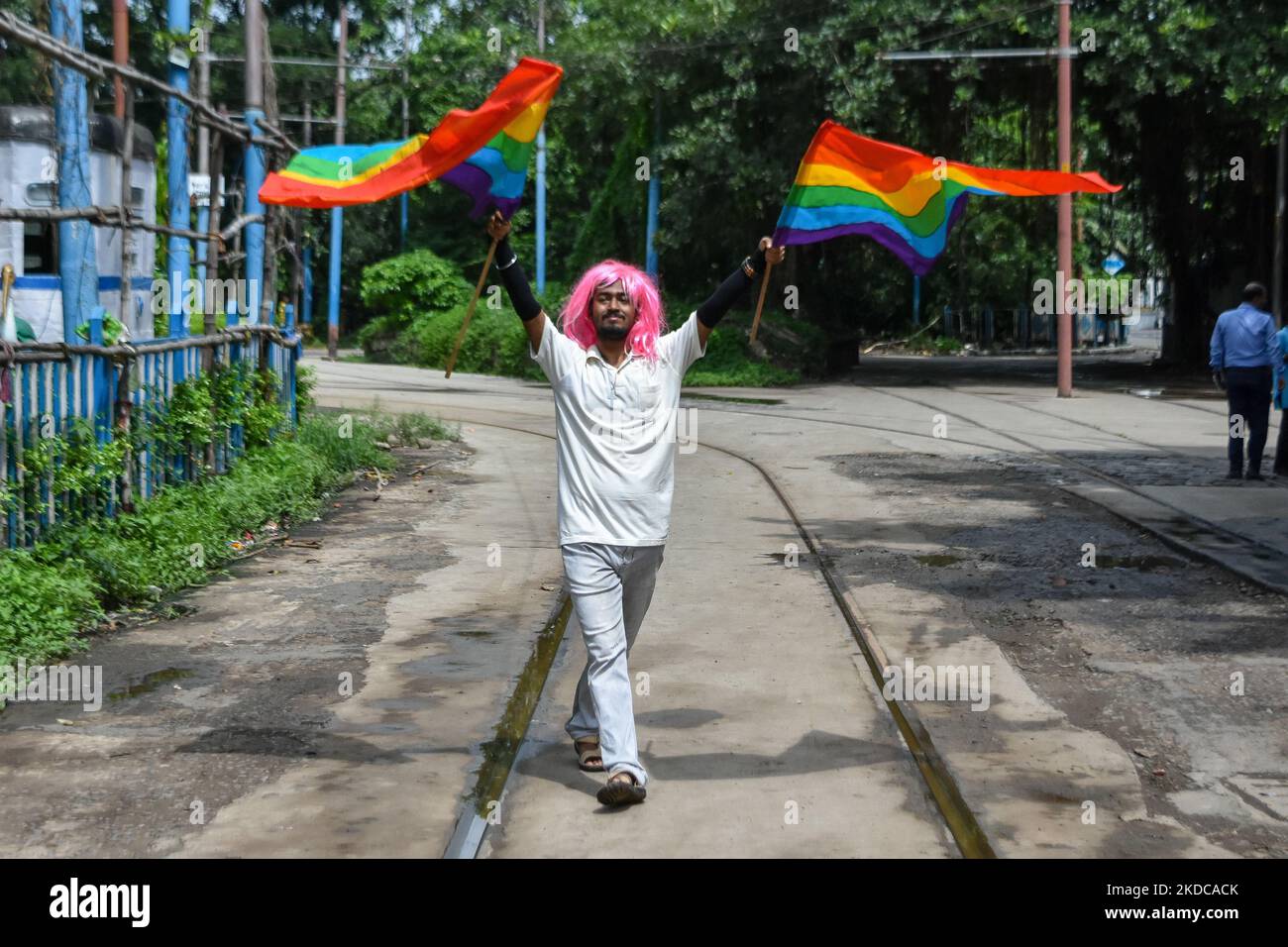 A participant poses for the camera during pride parade in Kolkata ...
