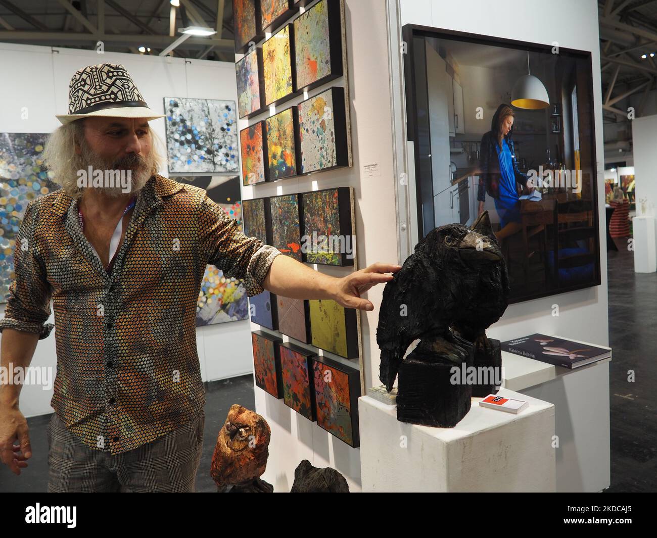 The Frank Massholder touching black raven sculpture Stock Photo - Alamy