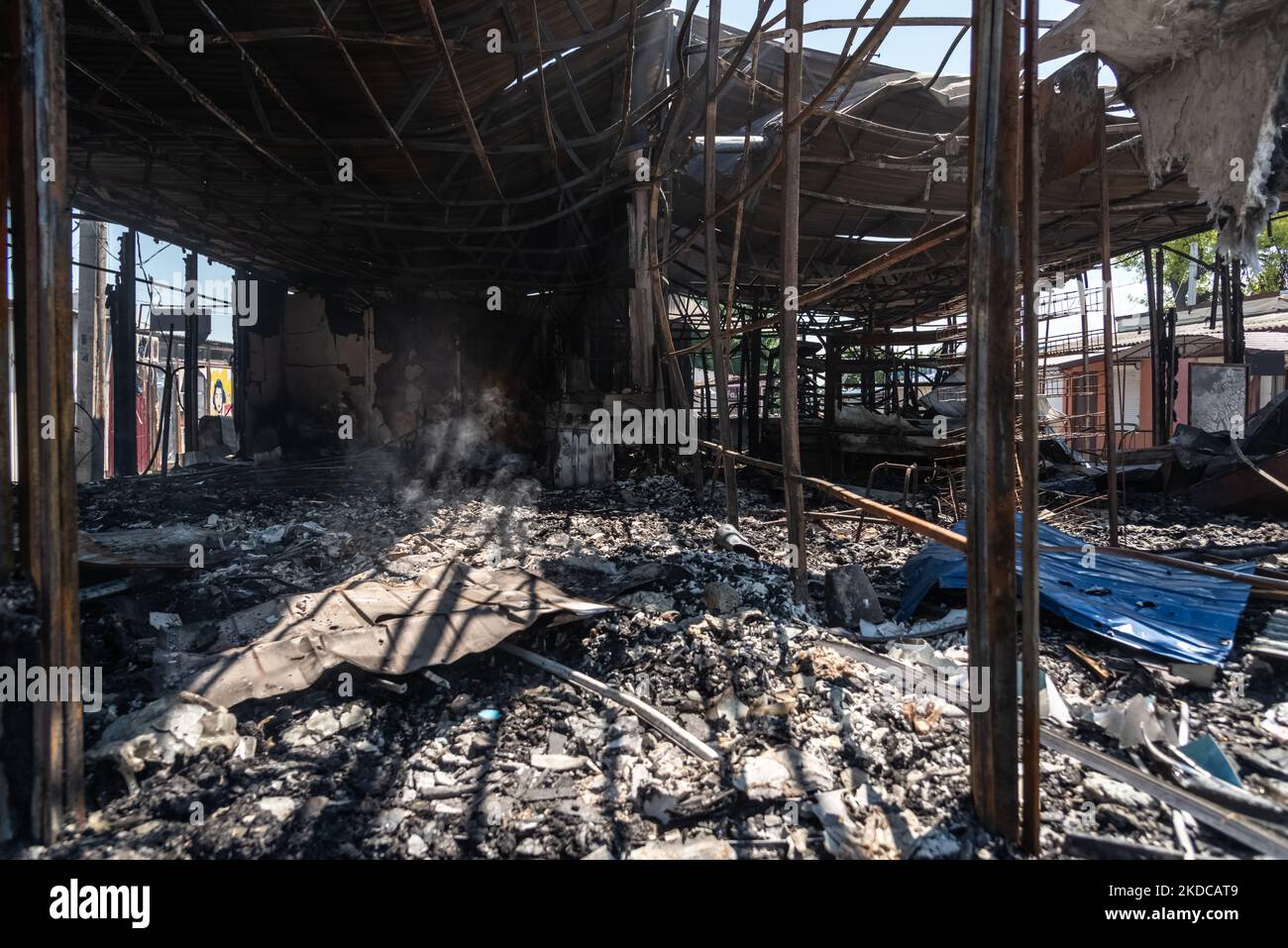 Destroyed shops are seen in area of the night shelling , in ...