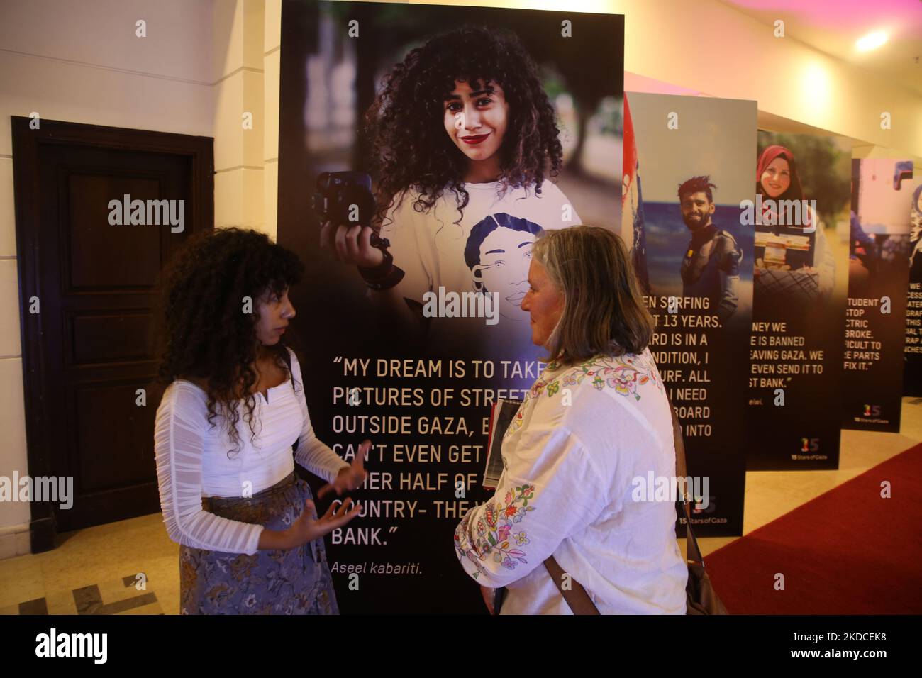 Palestinian photographer Aseel Kabariti poses for a photo next to a ...