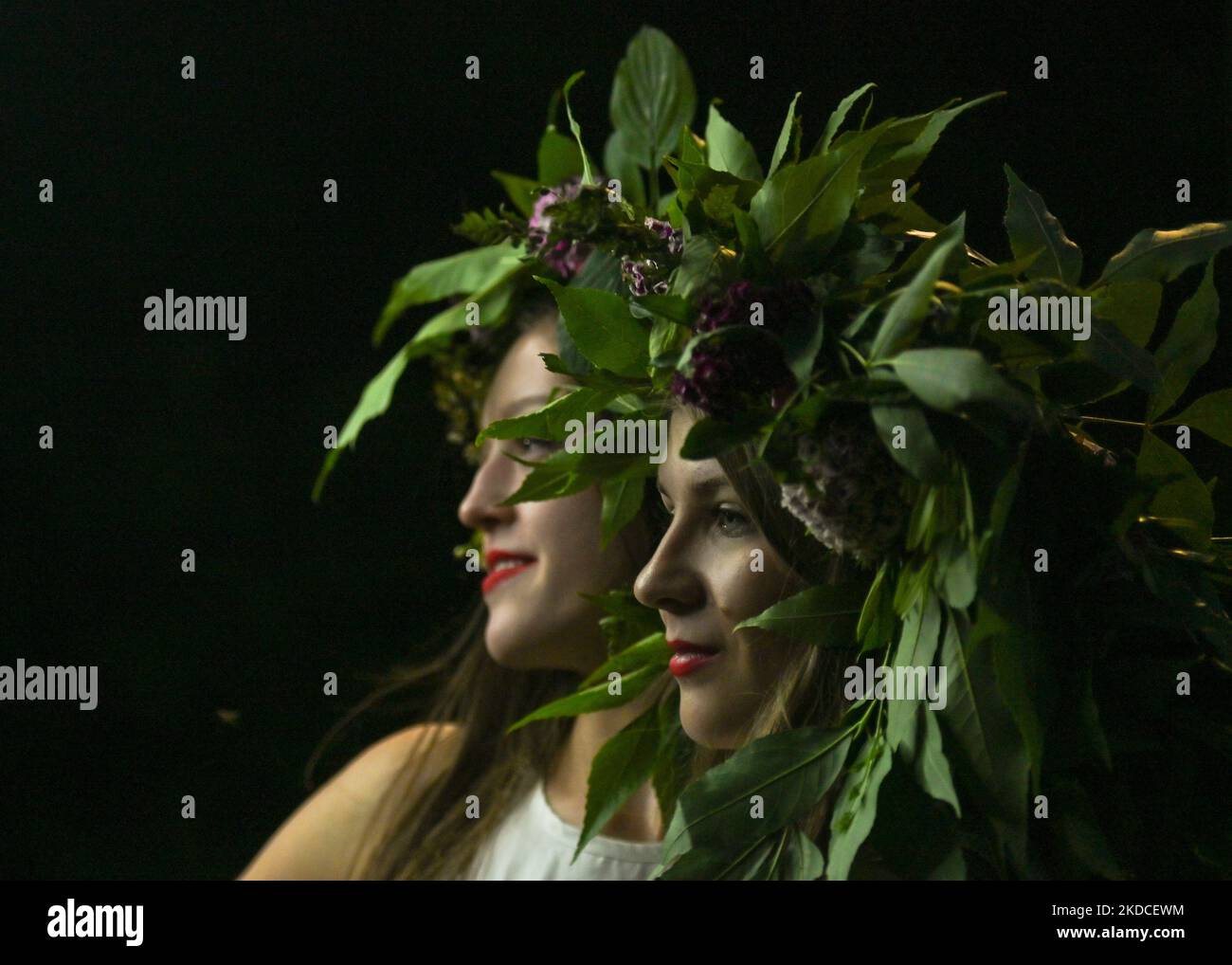 Two young women in a flower wreaths during the Kupala Night ...