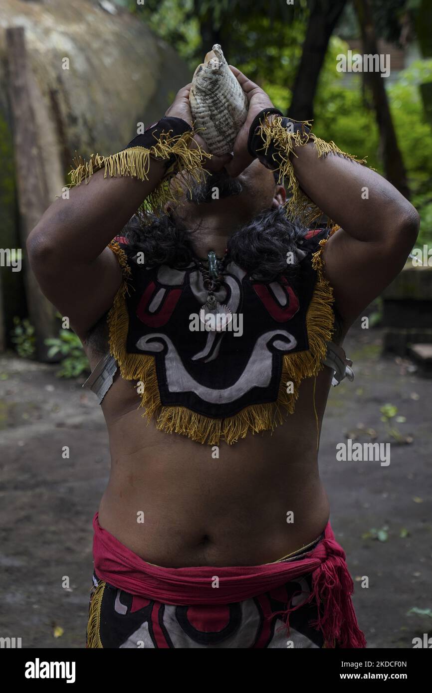 A Pipil dancer plays a conch traditional instrument during a summer ...