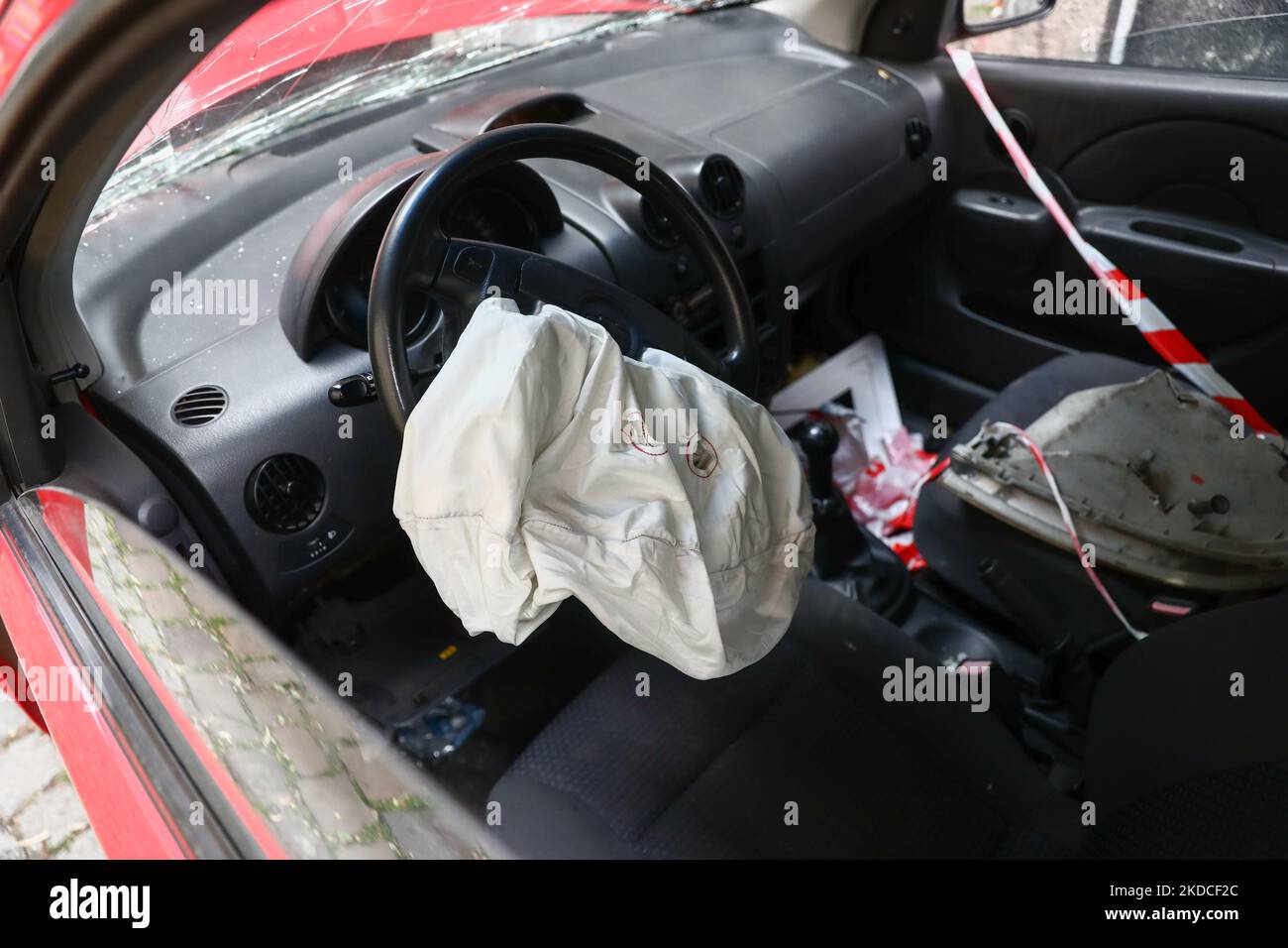 An deployed airbag is seen in a damaged car parked in Krakow, Poland on ...
