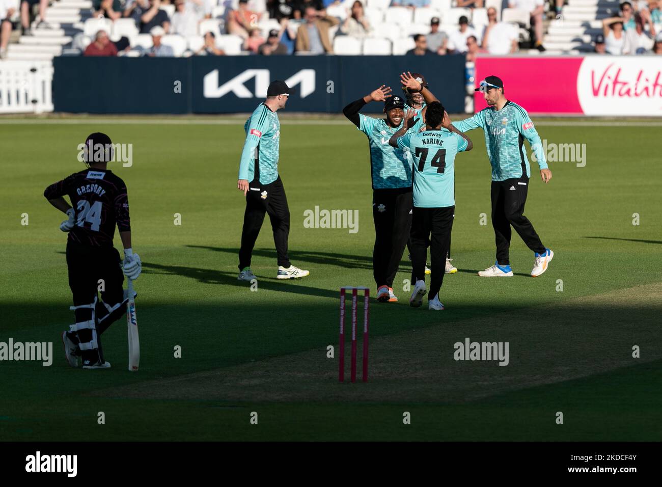 Chris Jordan of Surrey celebrates with Sunil Narine of Surrey during ...