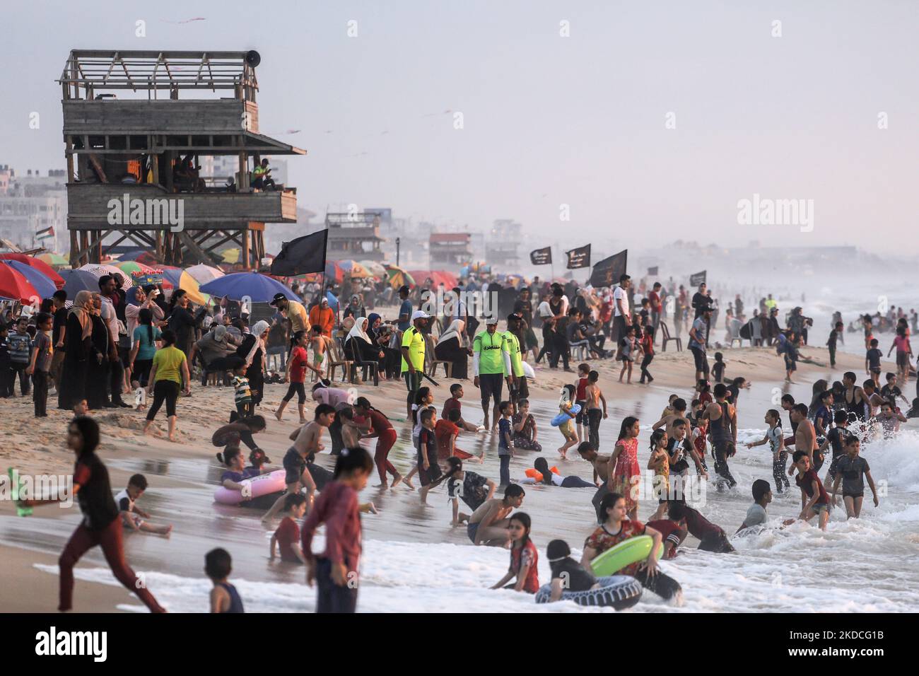 Palestinians swim in Gaza Beach to cool off on a hot day and enjoy ...