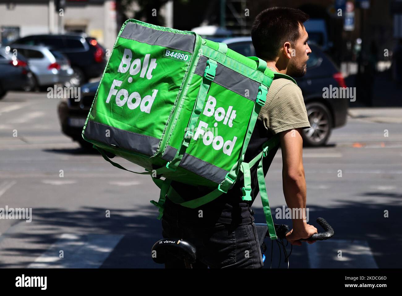 Bolt Food courier rides a street in Krakow, Poland on June 22, 2022 ...