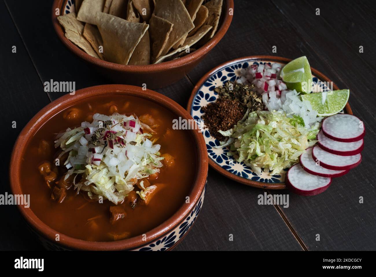 A closeup shot of Pozole Rojo(Mexican Pork and Hominy Stew),tortilla ...