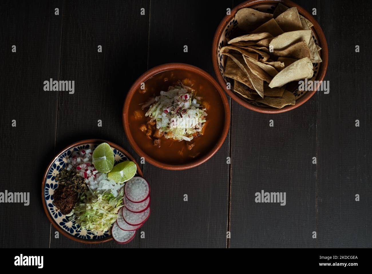 A top view of Pozole Rojo (Mexican Pork and Hominy Stew),tortilla chips ...