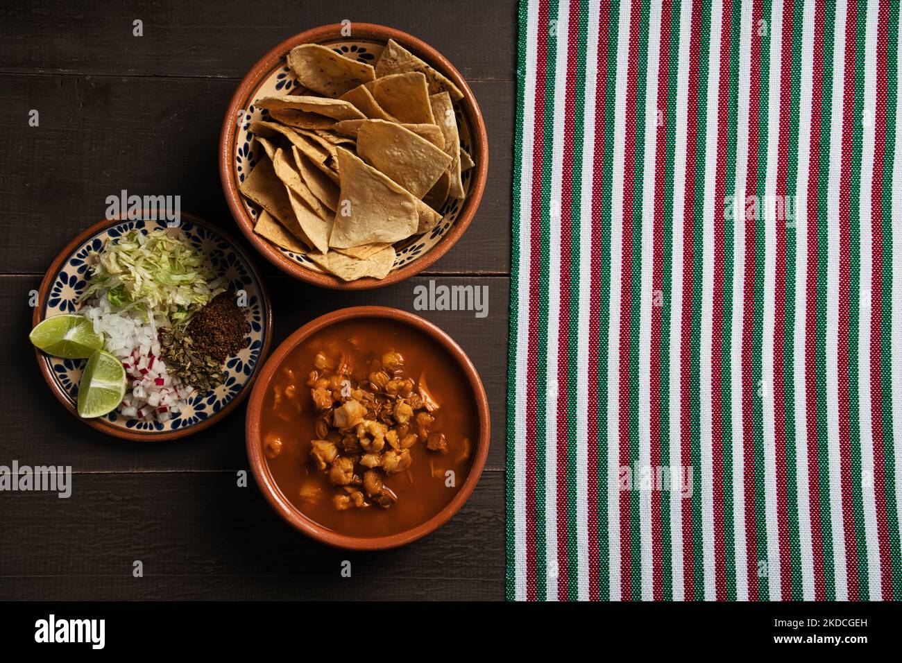 A top view of Pozole Rojo (Mexican Pork and Hominy Stew),tortilla chips ...