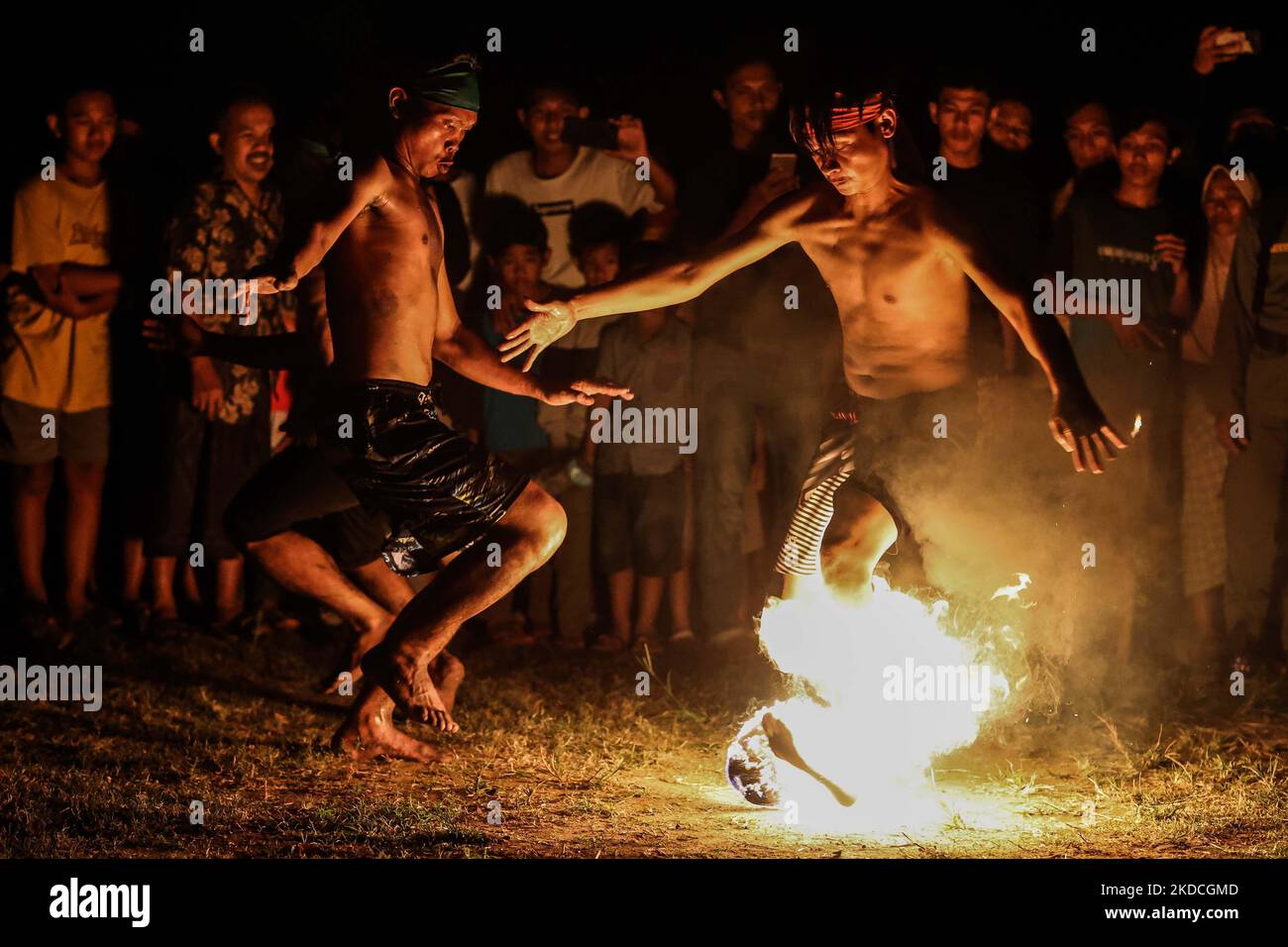 Villagers playing fire football, known locally as "sepak bola api", a ...