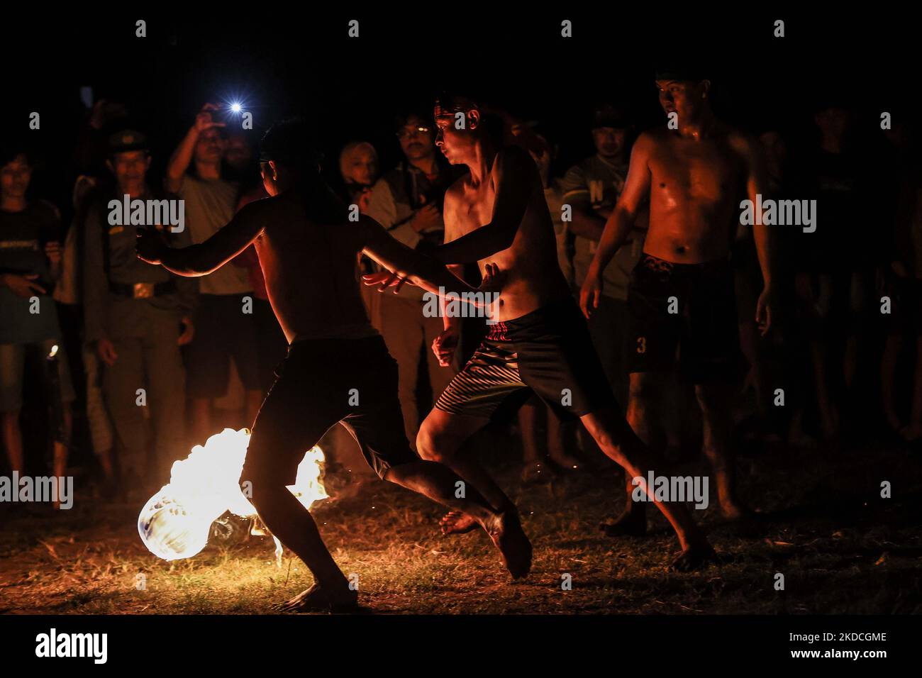 Villagers playing fire football, known locally as "sepak bola api", a ...