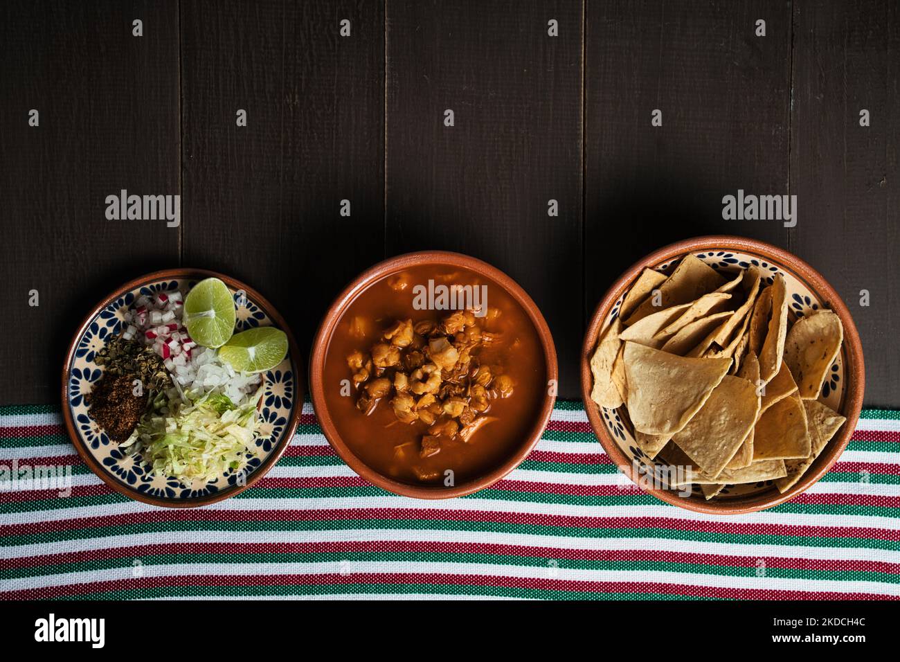 A top view of Pozole Rojo (Mexican Pork and Hominy Stew),tortilla chips ...