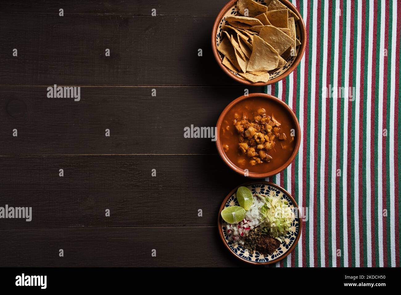 A top view of Pozole Rojo (Mexican Pork and Hominy Stew),tortilla chips ...
