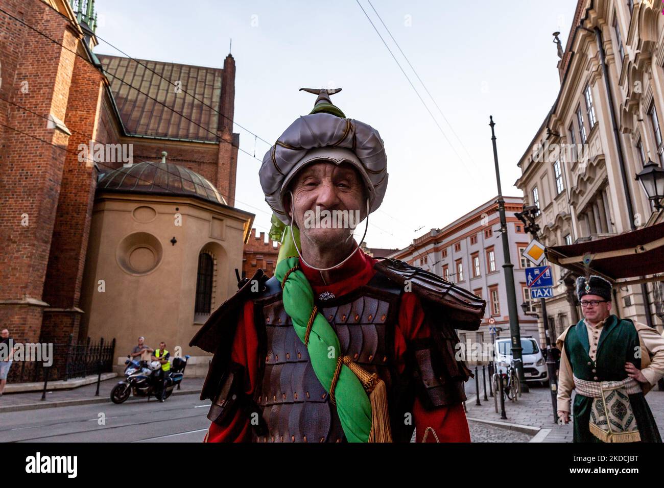 A man dressed as Tatar walks in a parade of Lajkonik, a folklore ...