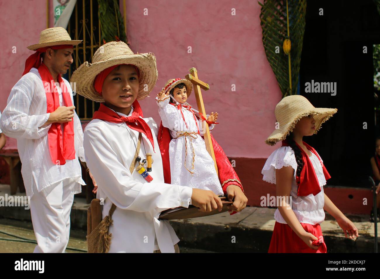 A boy holds an image of St. John the Baptist during the festival of St ...