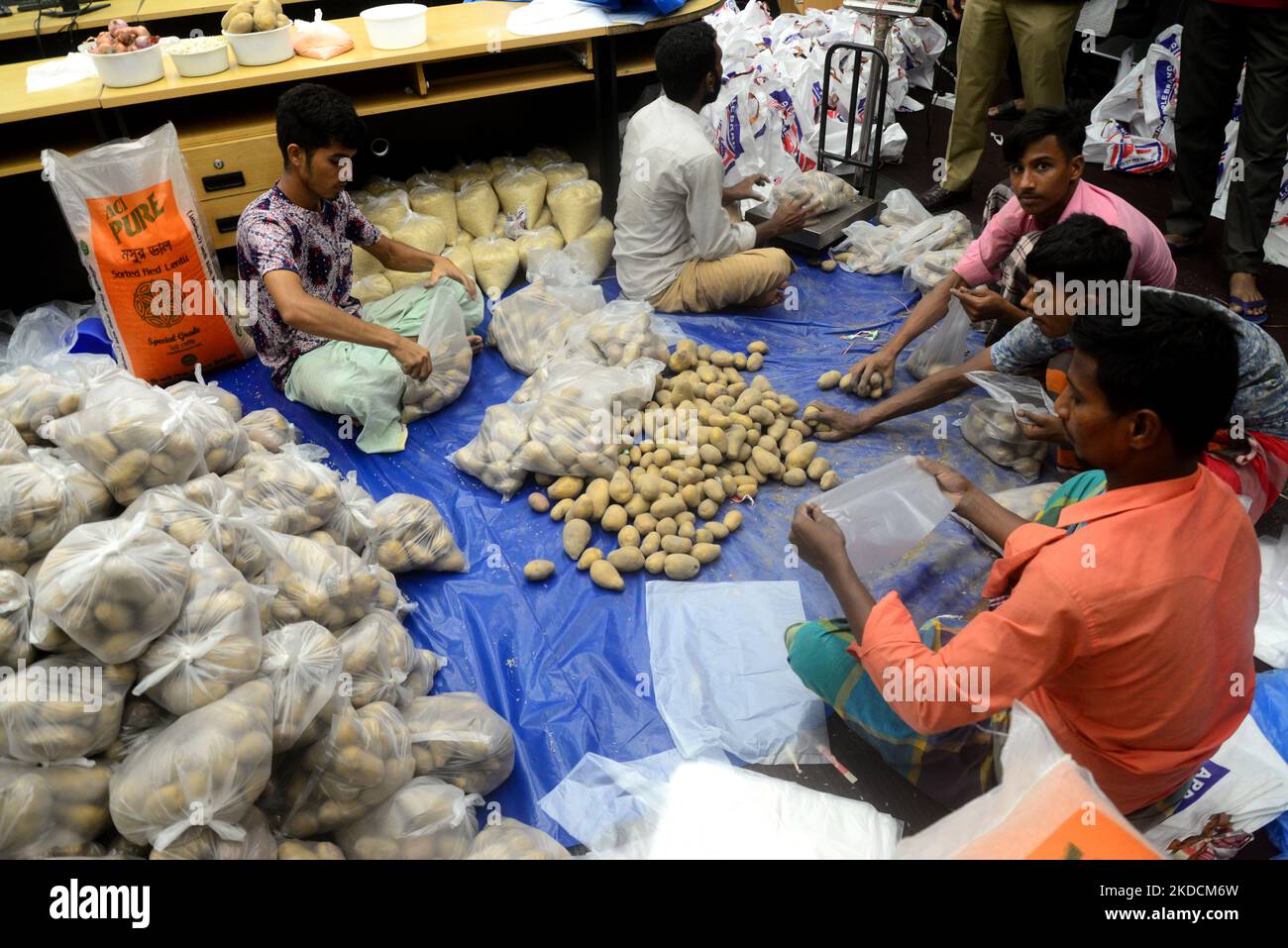 Volunteers pack relief materials for flood affected people in Dhaka ...
