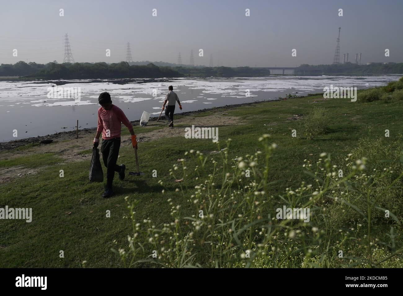 Volunteers from a non-governmental organization participate in a ...
