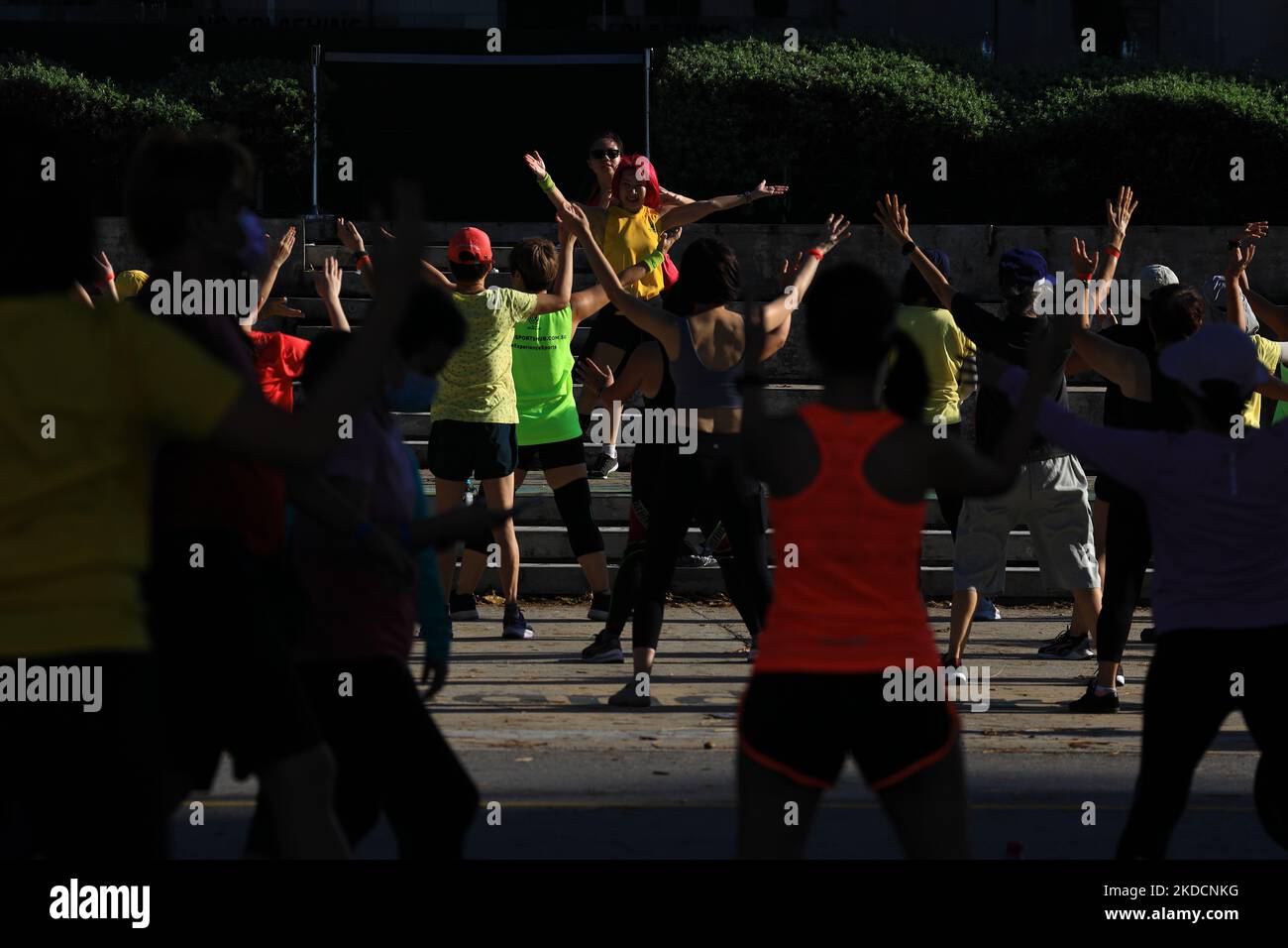 Women exercise at a park on June 26, 2022 in Singapore. (Photo by ...