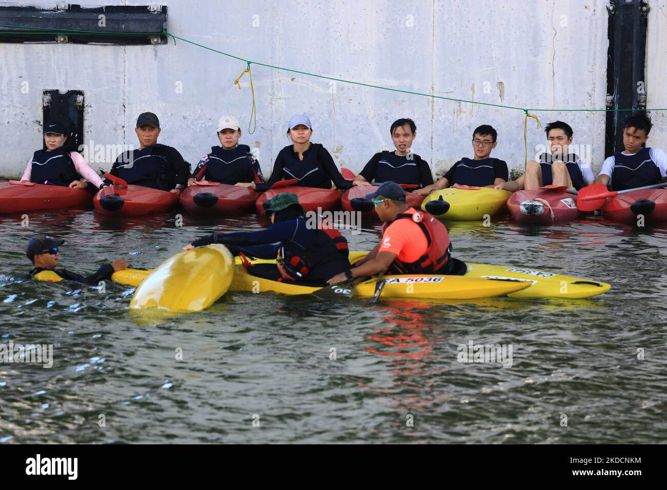 People learn kayaking at Marina Bay on June 26, 2022 in Singapore ...