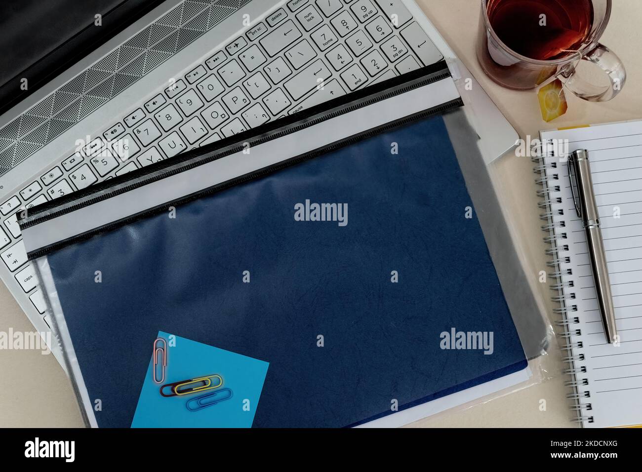 A top view of an office desk table with a lot of things on it Stock ...