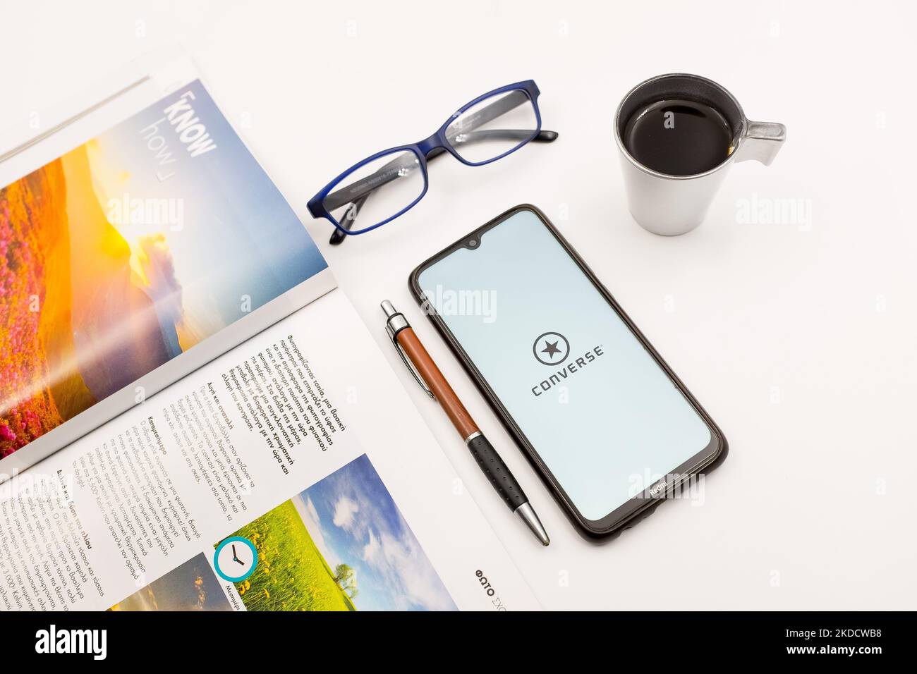 In this photo illustration a Converse logo seen displayed on a ...