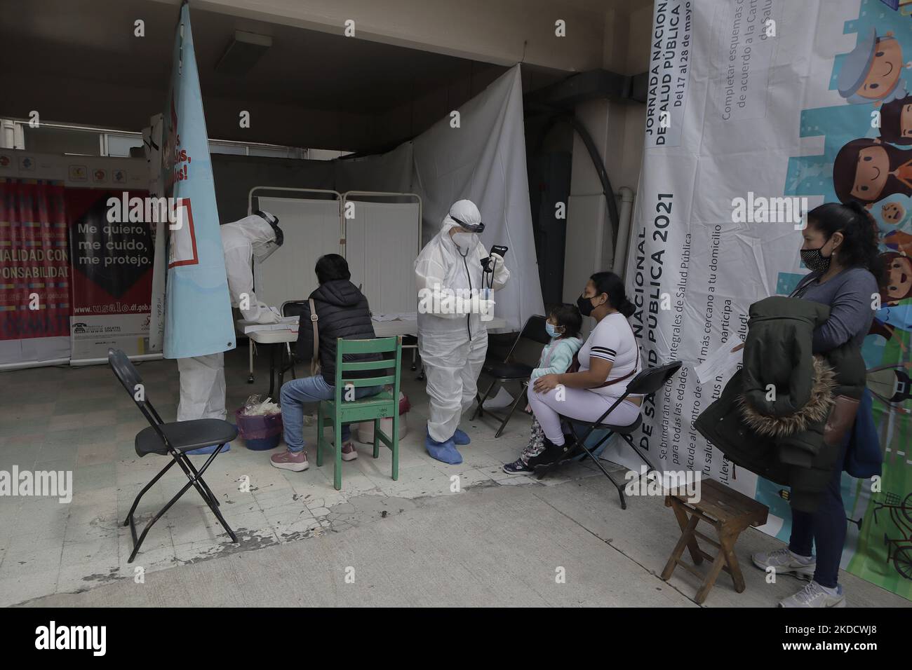 Medical staff attend to a mother and daughter outside the T-III Dr ...