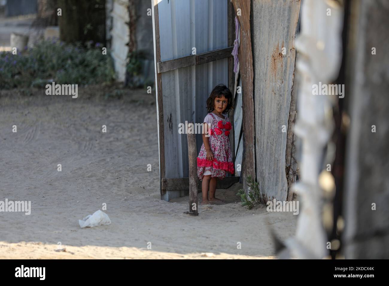 Palestinian girl stands in front of her house in Beit Hanoun in the ...