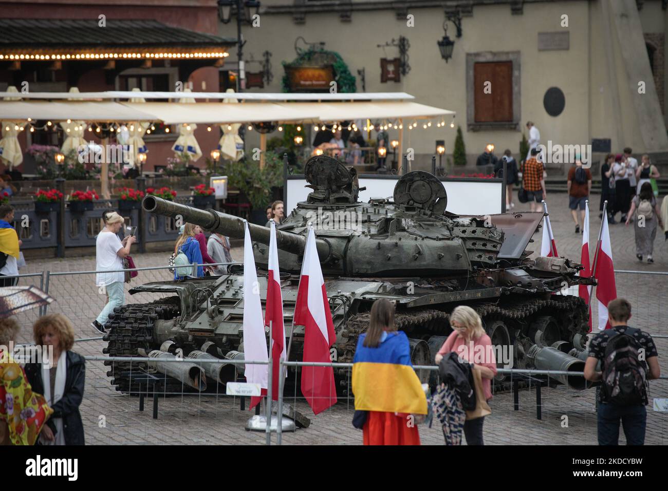 Visitors are seen looking at a Russian T-72 tank near the Royal Castle ...
