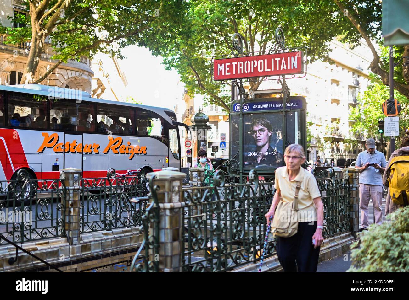 A woman about to enter the metro station. Daily life in Parisian metro ...