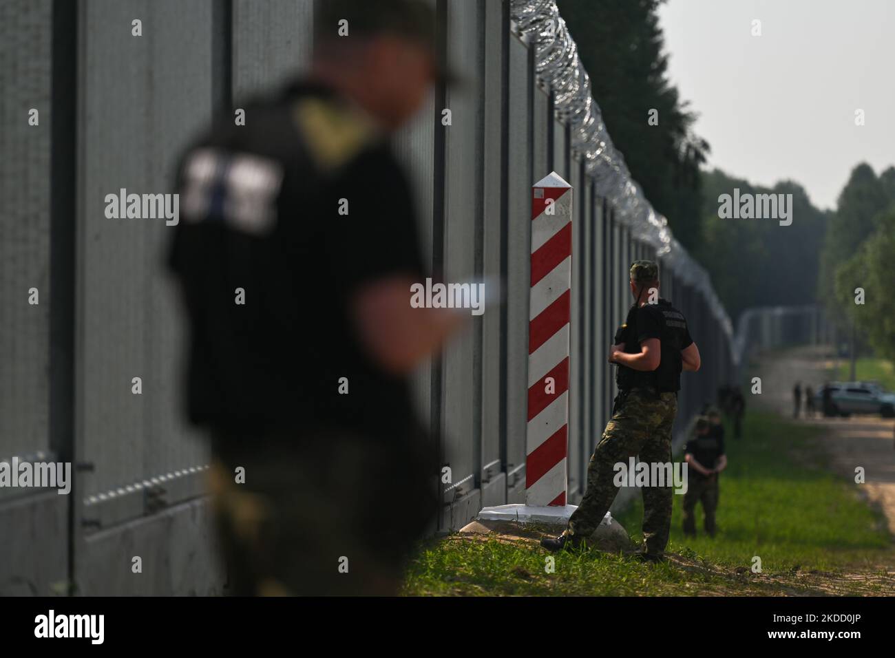 A general view of the border fence and border guards at the Polish ...