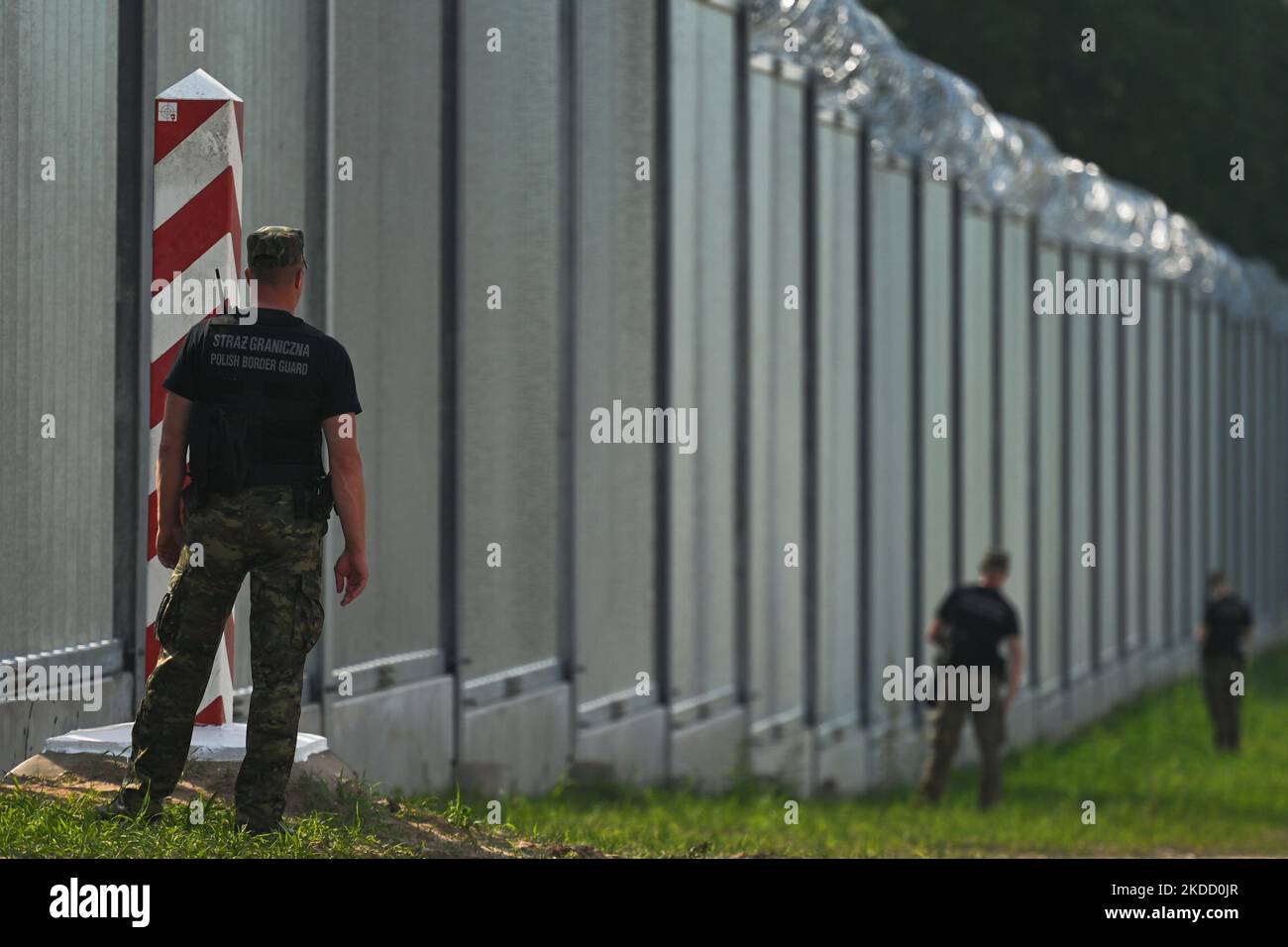 A general view of the border fence and border guards at the Polish ...