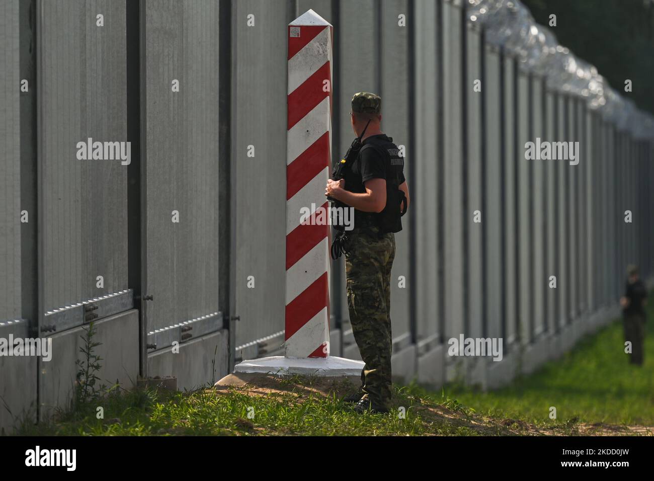 A general view of the border fence and border guards at the Polish ...