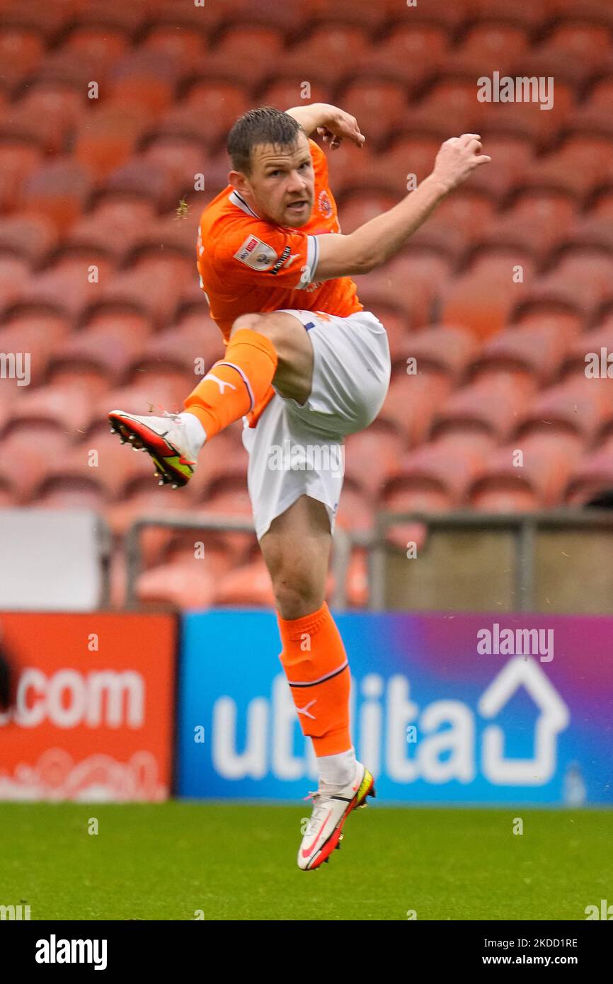 Jordan Thorniley #34 of Blackpool drives a shot at the Luton Town goal ...