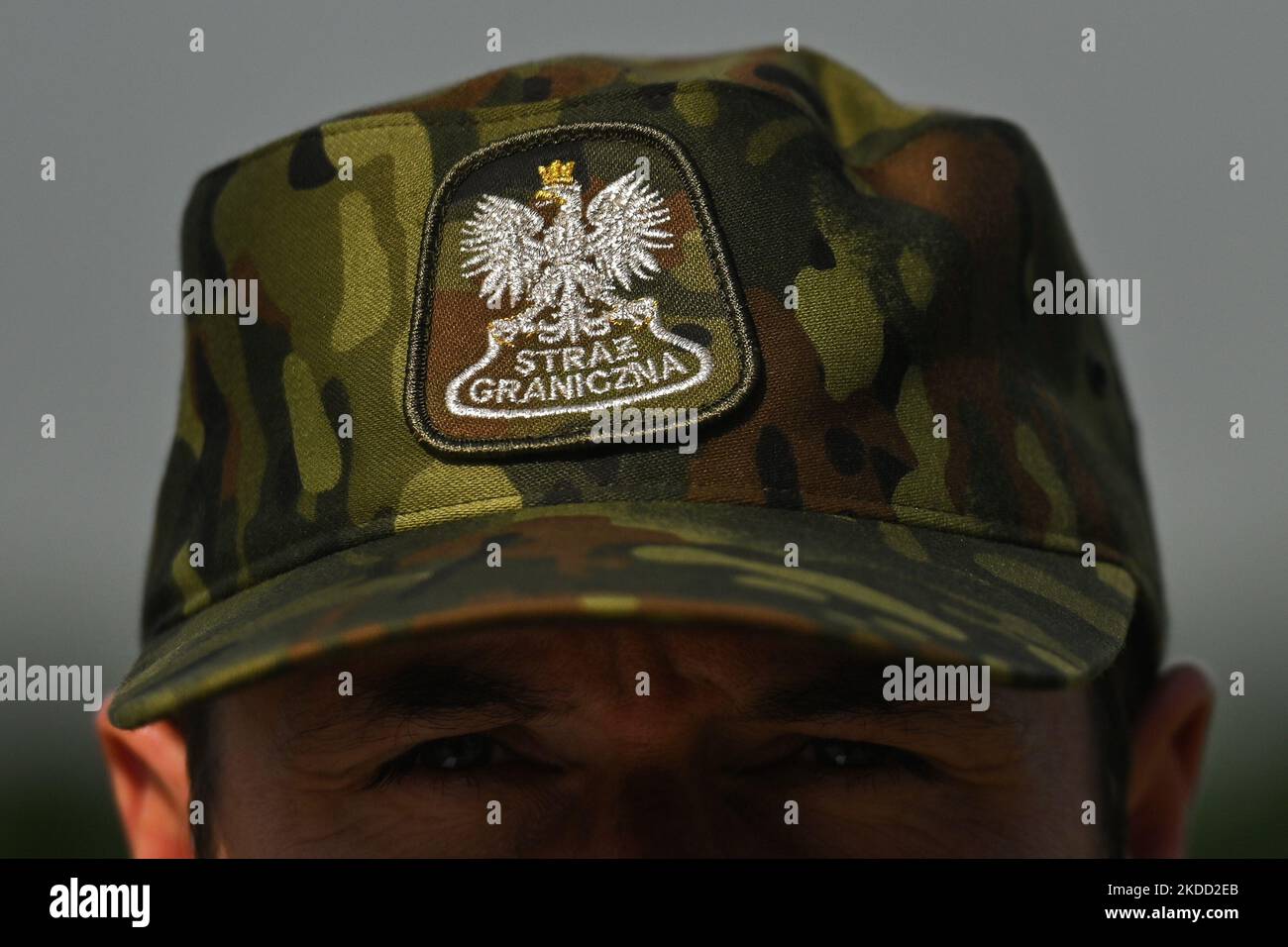 Polish border guard near the new fence on the Polish-Belarusian border ...