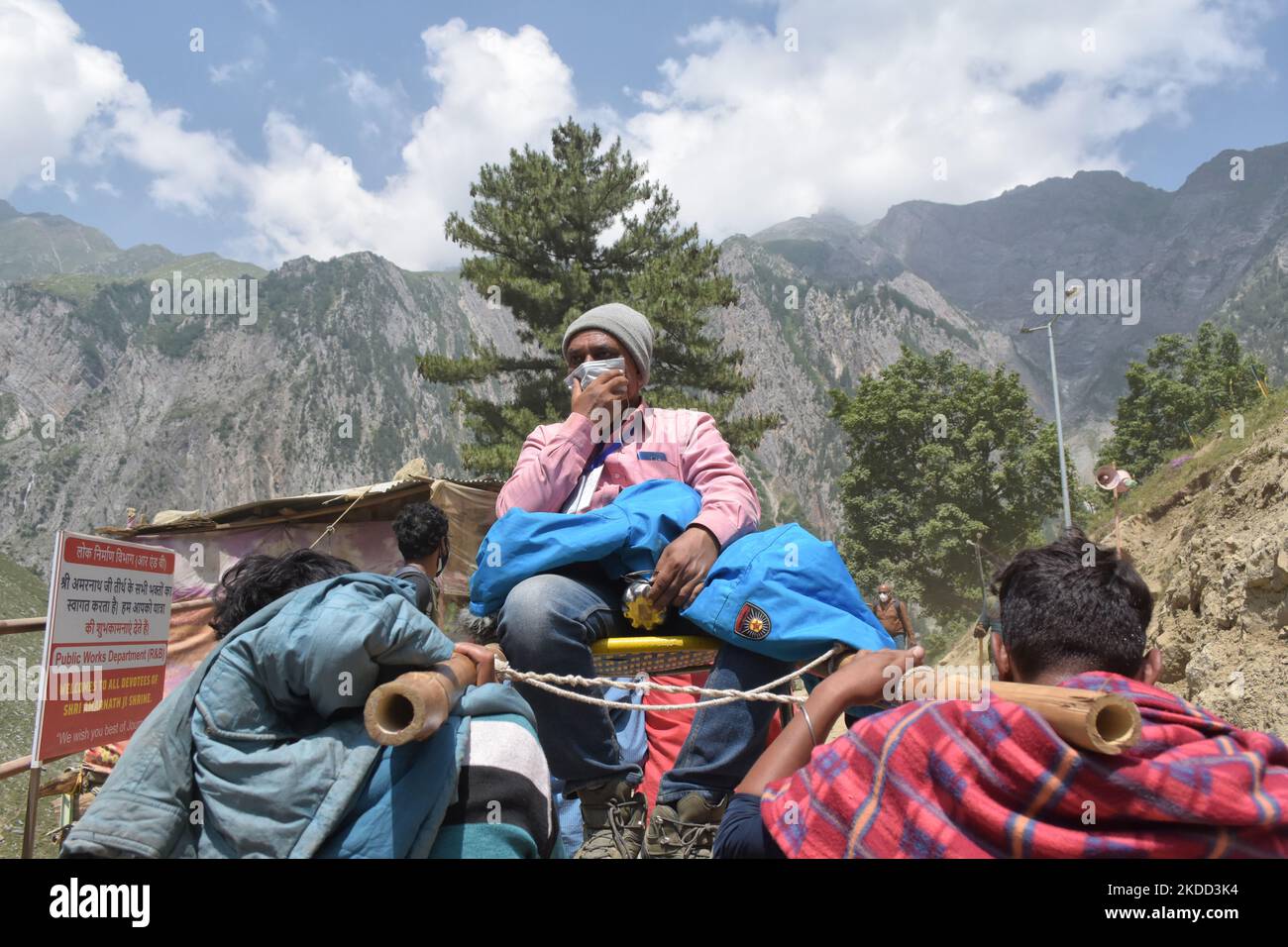 Local Kashmiri porters carry Hindu pilgrims to the Amarnath cave during ...