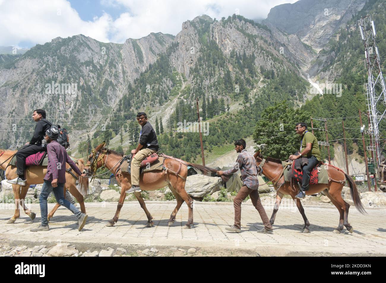 Hindu pilgrims ride horses toward the Amarnath cave during the yearly ...