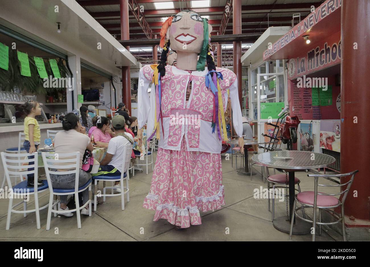A member of the ballet folklorico de Cananea, carrying a mojiganga ...