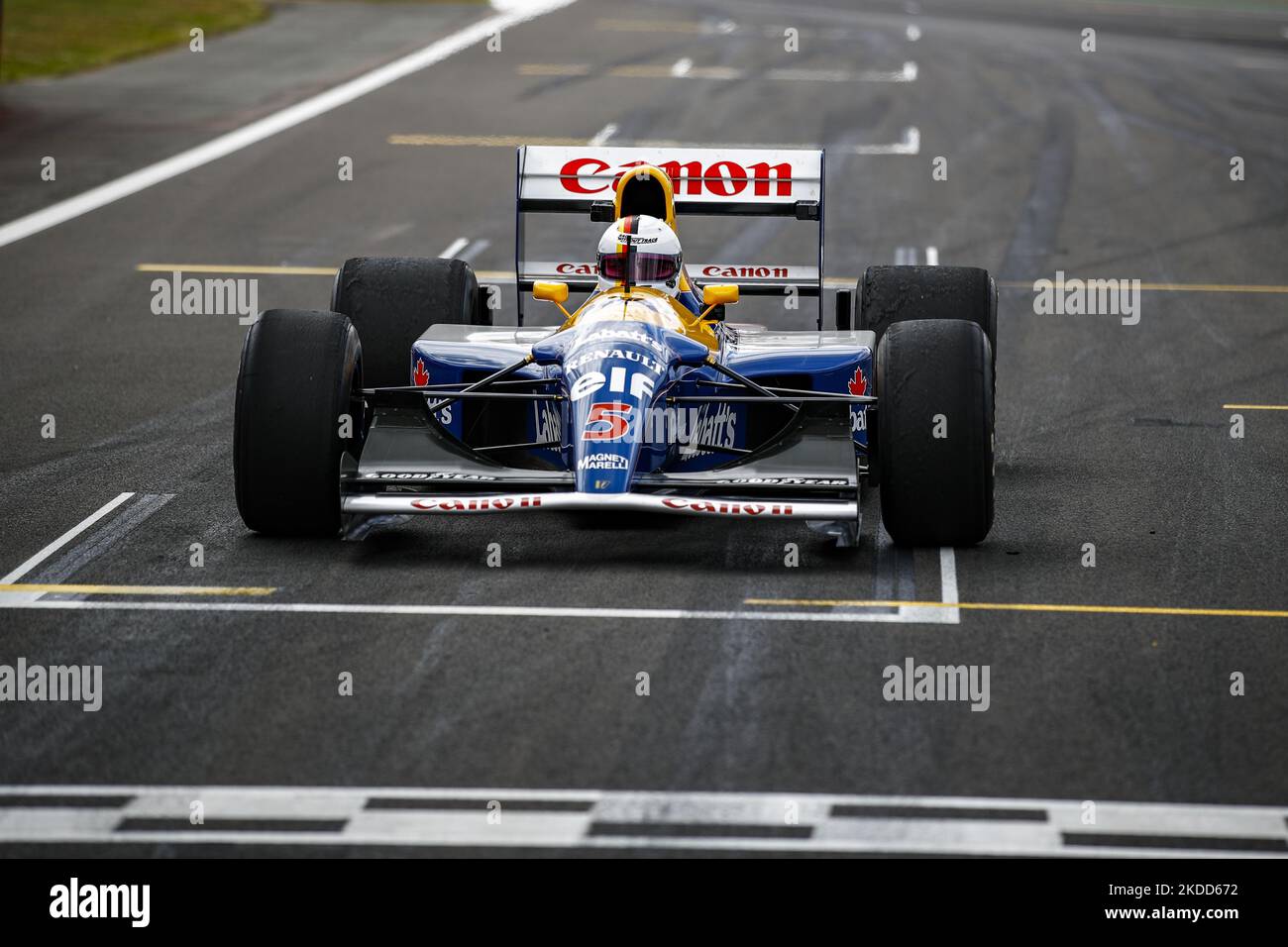 Sebastian Vettel with the 1992 Williams FW14 of Nigel Mansell during ...