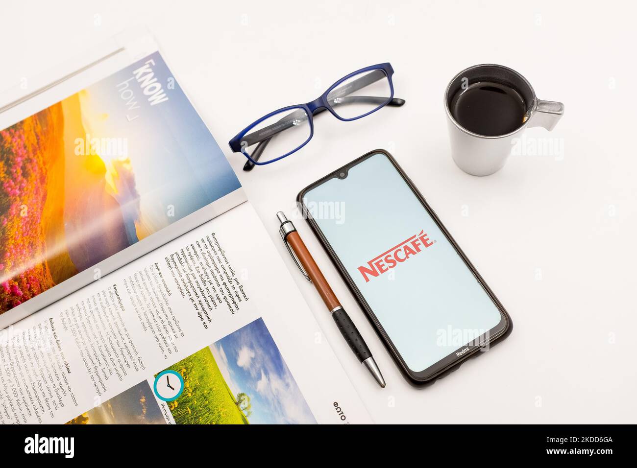 In this photo illustration a Nescafe logo seen displayed on a ...