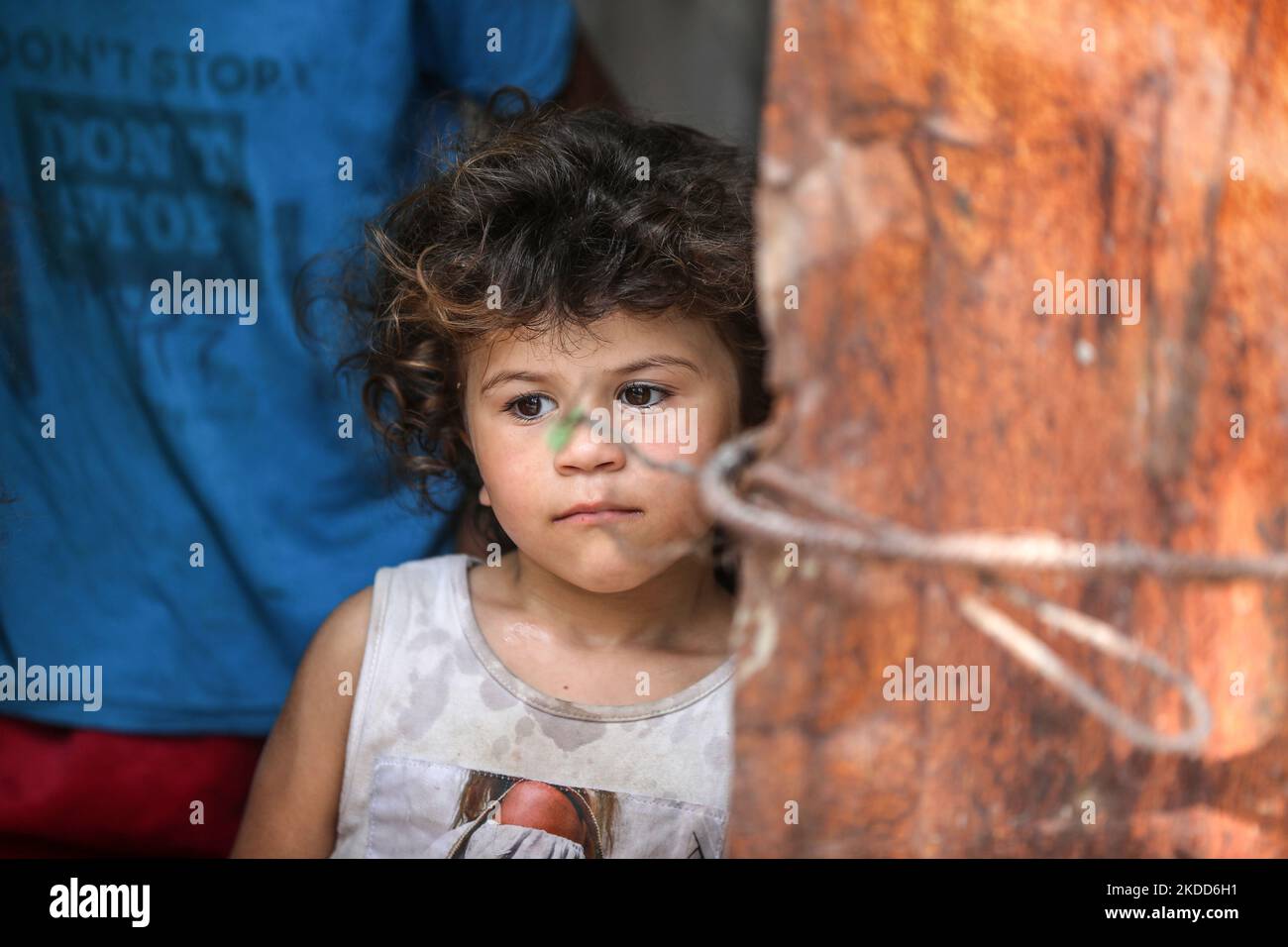 Palestinian children play inside their home in a poor neighborhood in ...