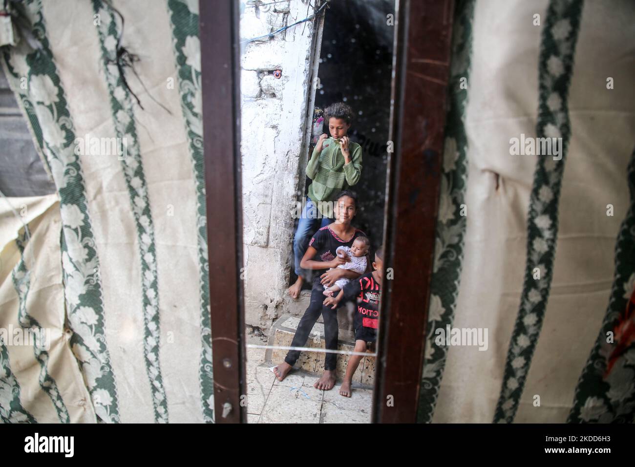 Palestinian children play inside their home in a poor neighborhood in ...